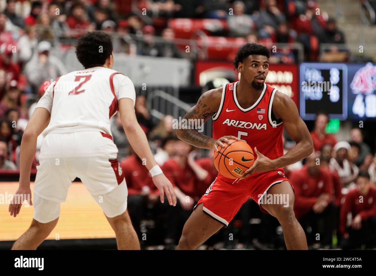 Arizona guard KJ Lewis, right, controls the ball while pressured by ...