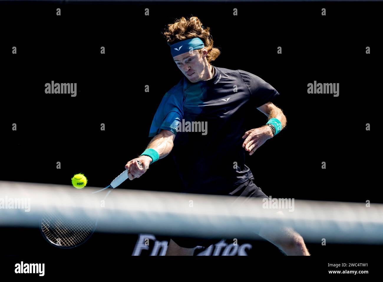 MELBOURNE, VIC - JANUARY 14: Andrey Rublev of Russia in action during ...