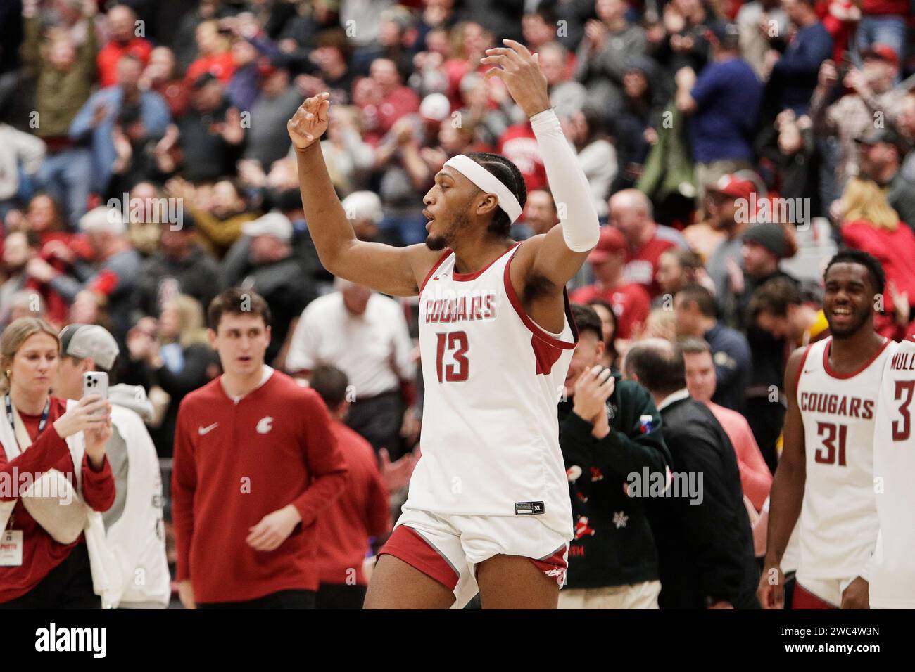 Washington State forward Isaac Jones (13) celebrates the team's 73-70 ...
