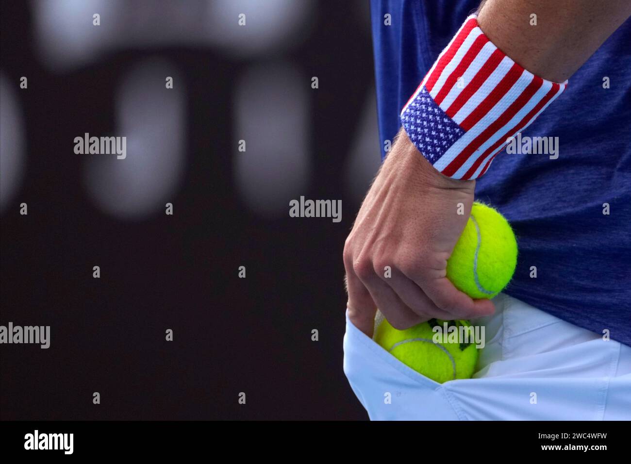 J.J. Wolf of the U.S. prepares to serve to Sebastian Baez of Argentina ...