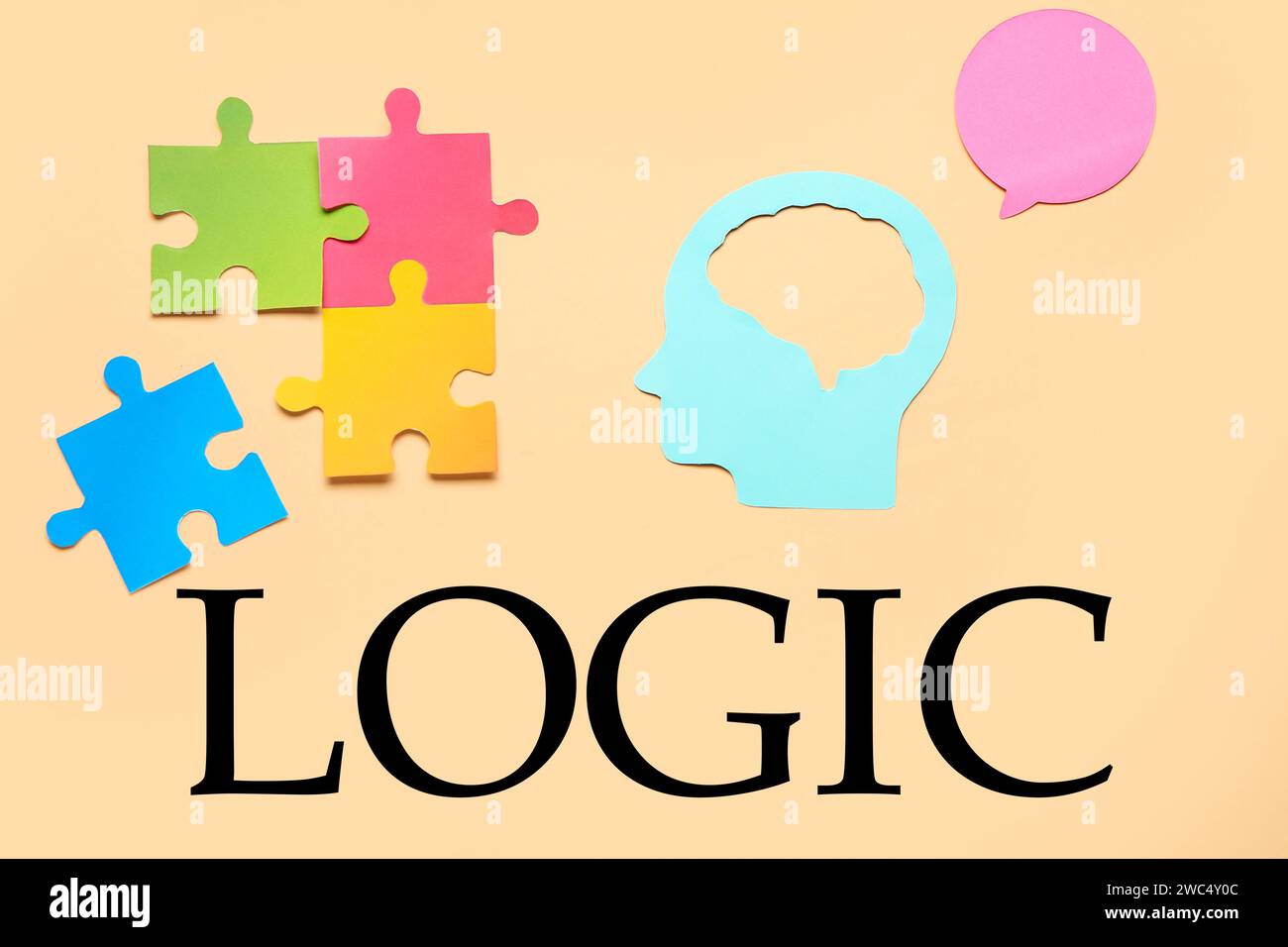 Paper human head, speech bubble, word LOGIC and jigsaw puzzle pieces on ...