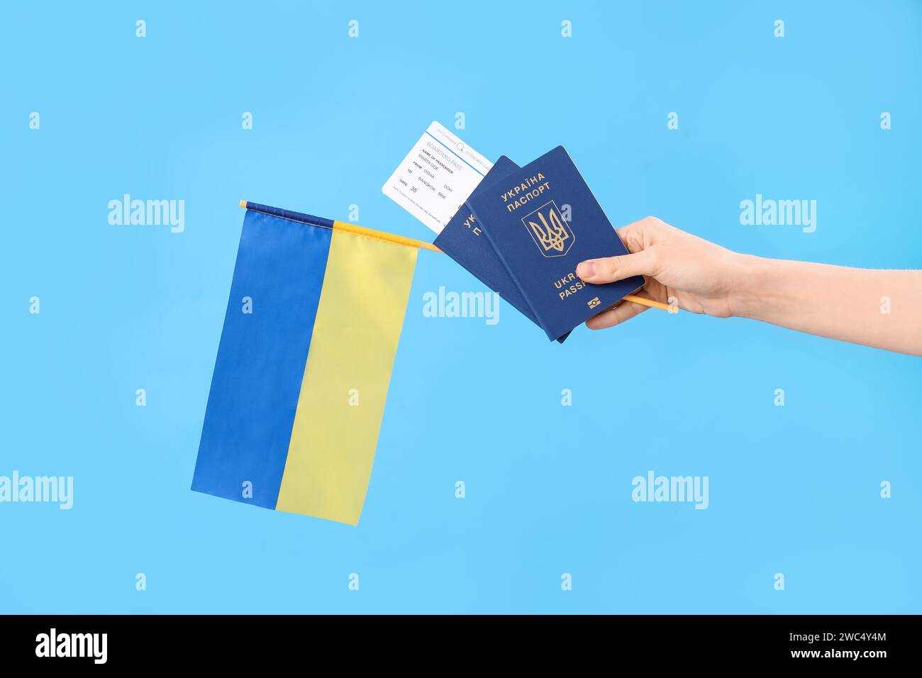 Woman With Passports Ticket And Flag Of Ukraine On Blue Background