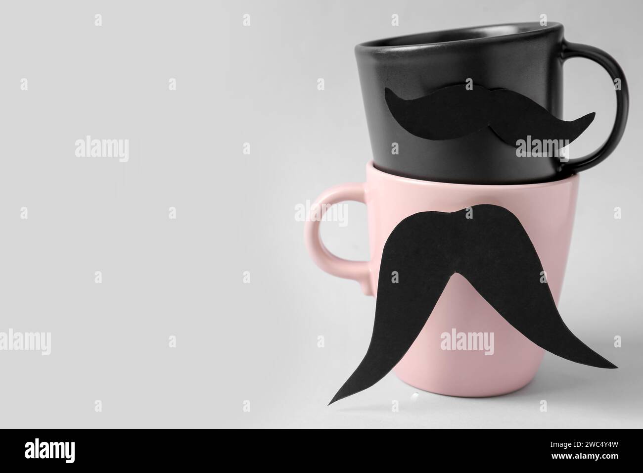 Cups with paper mustache on grey background Stock Photo - Alamy