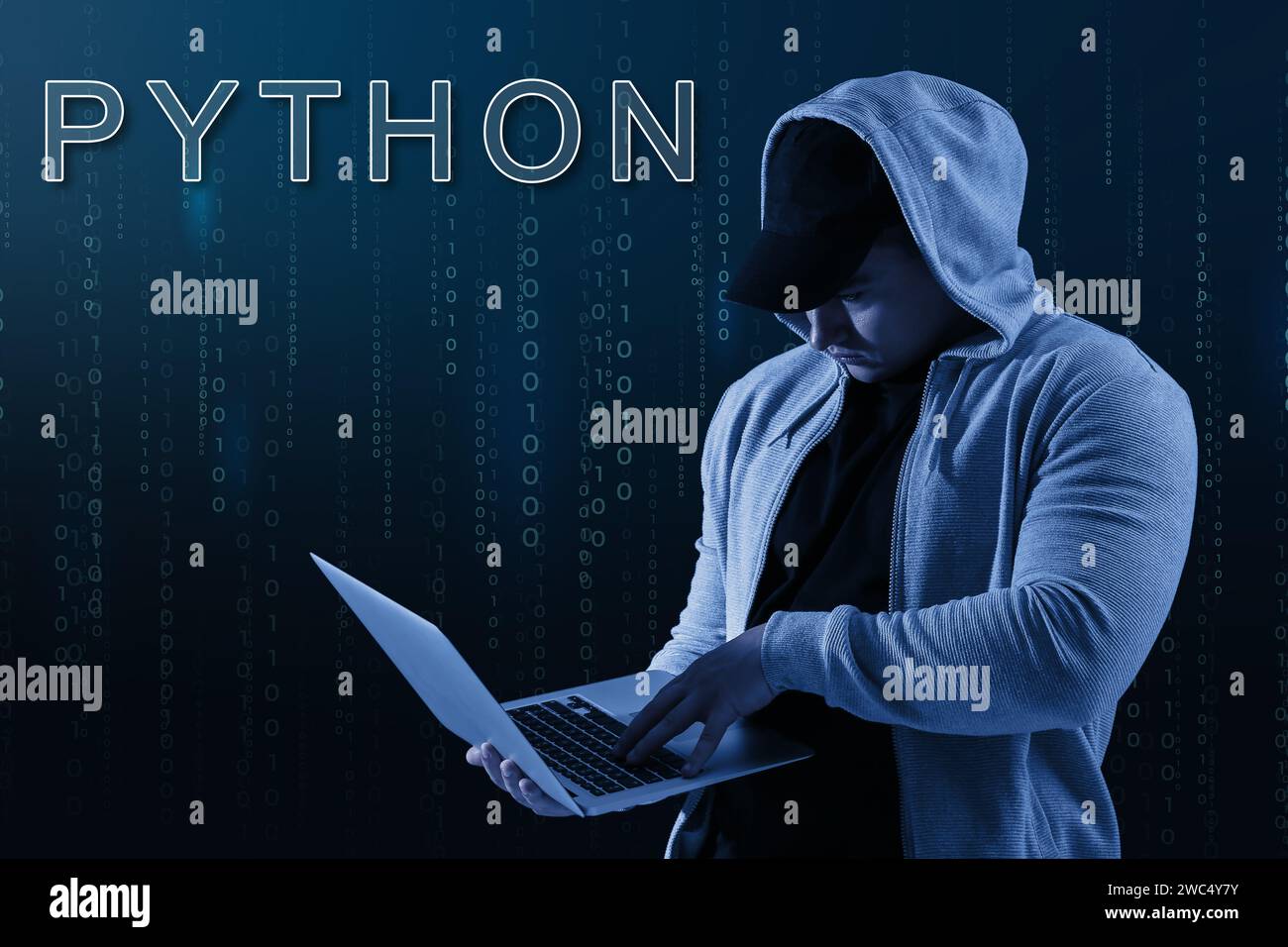 Professional hacker with laptop on dark background Stock Photo - Alamy
