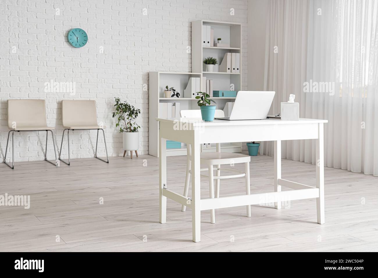 Interior of modern clinic with workplace and chairs Stock Photo - Alamy