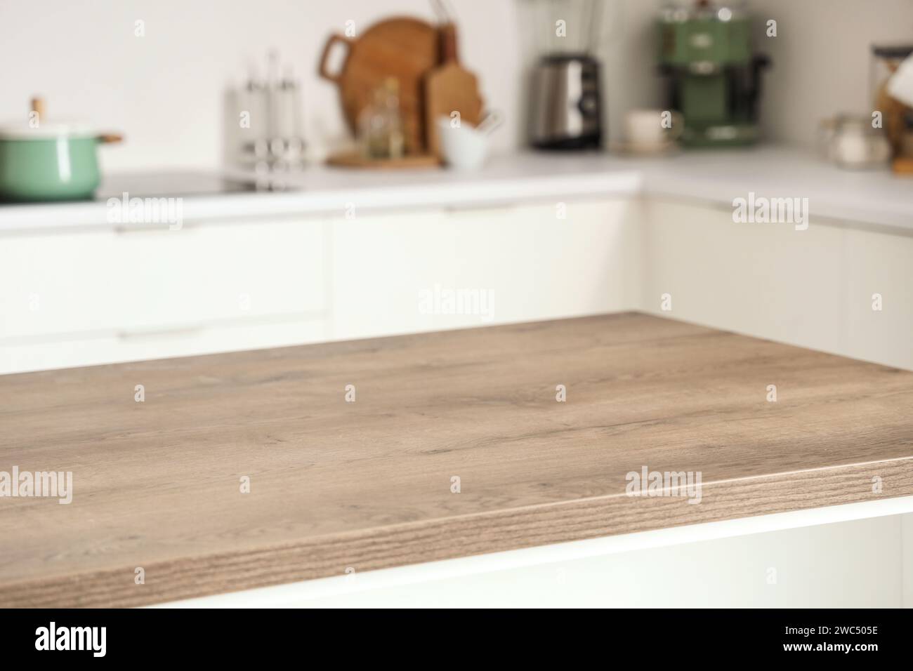 Clean wooden table in modern kitchen, closeup Stock Photo - Alamy