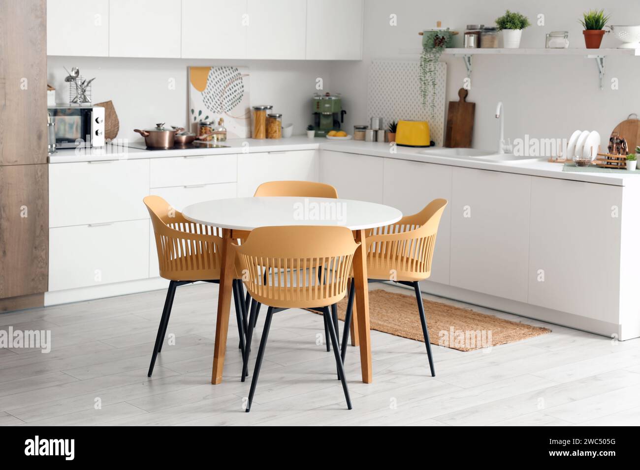 Clean white table in interior of modern kitchen Stock Photo - Alamy