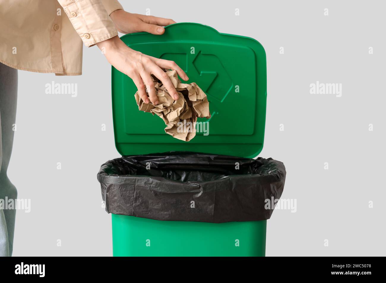 Woman throwing crumpled paper hi-res stock photography and images - Alamy