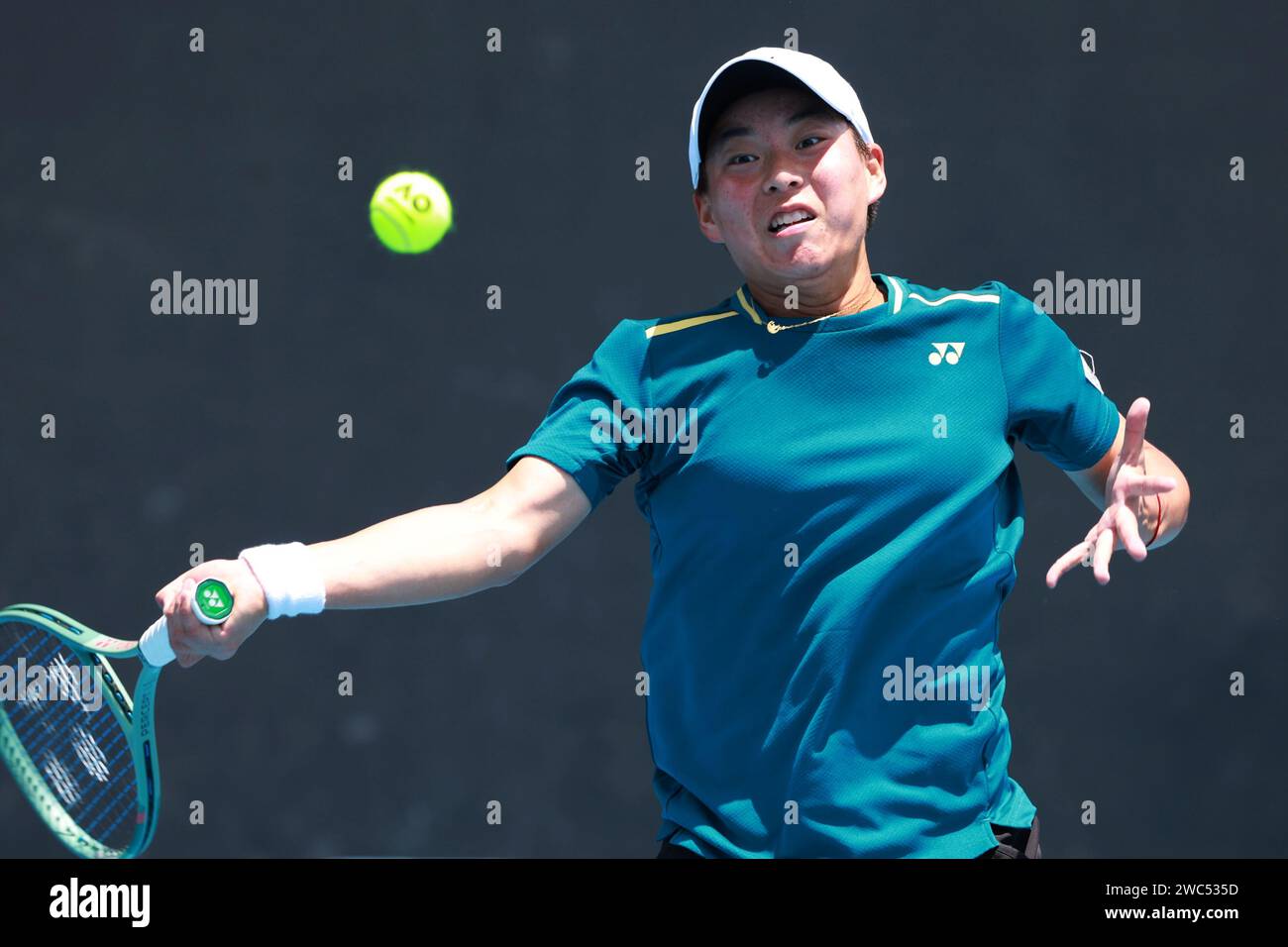 Melbourne, Australia. 14th Jan, 2024. Bai Zhuoxuan hits a return during ...