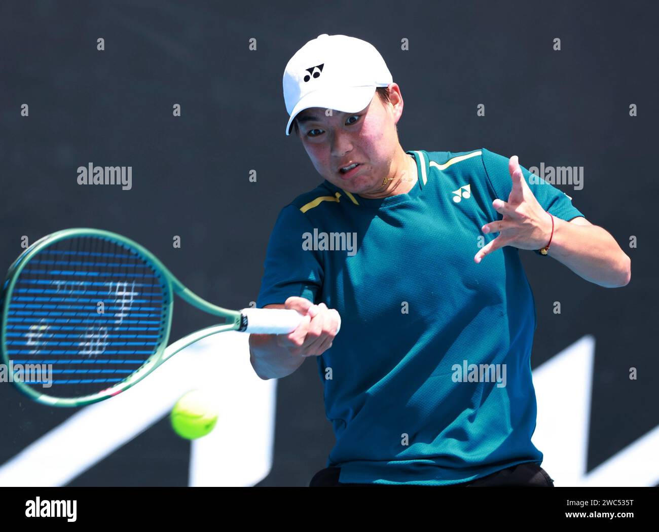 Melbourne, Australia. 14th Jan, 2024. Bai Zhuoxuan hits a return during ...