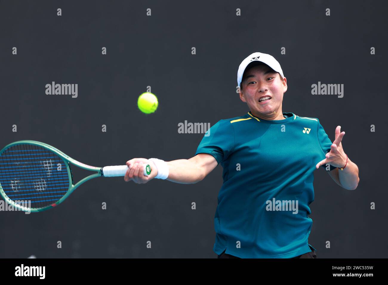 Melbourne, Australia. 14th Jan, 2024. Bai Zhuoxuan hits a return during ...