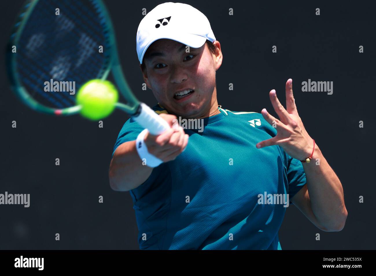 Melbourne, Australia. 14th Jan, 2024. Bai Zhuoxuan hits a return during ...