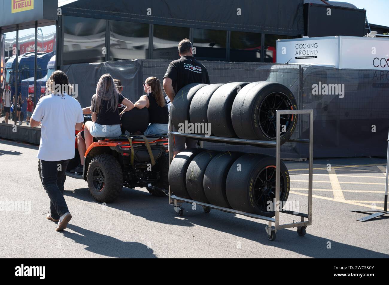 The racing team transports the nummatics from the shelf with a quad ...