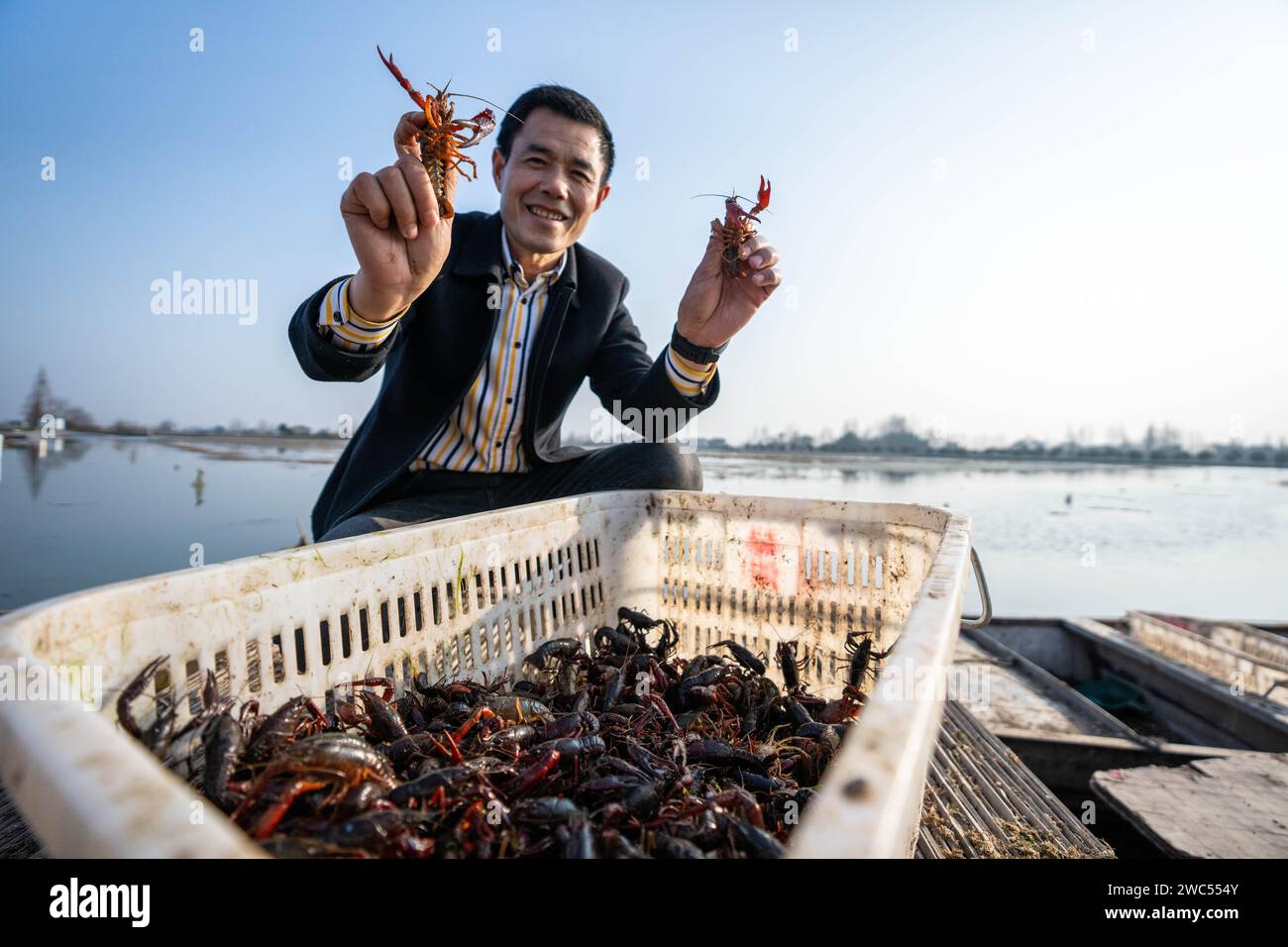 Changsha, China's Hunan Province. 14th Jan, 2024. A farmer displays ...
