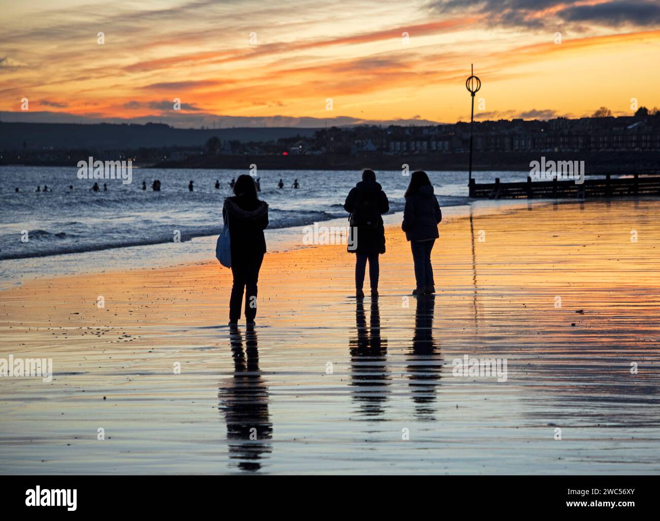 Portobello, Edinburgh, Scotland, UK. 14 January 2024. Onlookers on the ...
