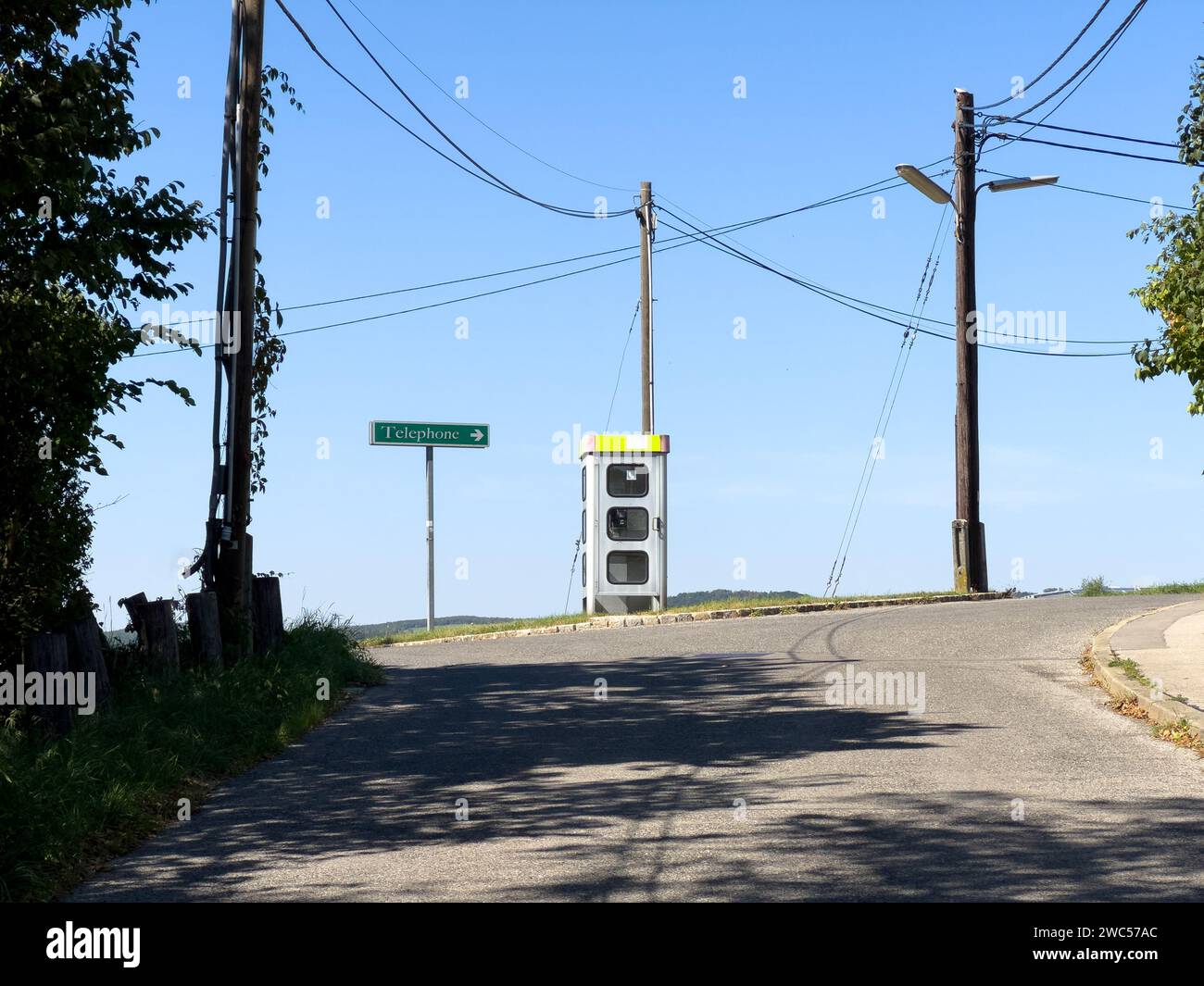 At the end of a road leading up a hill is an old telephone box ...