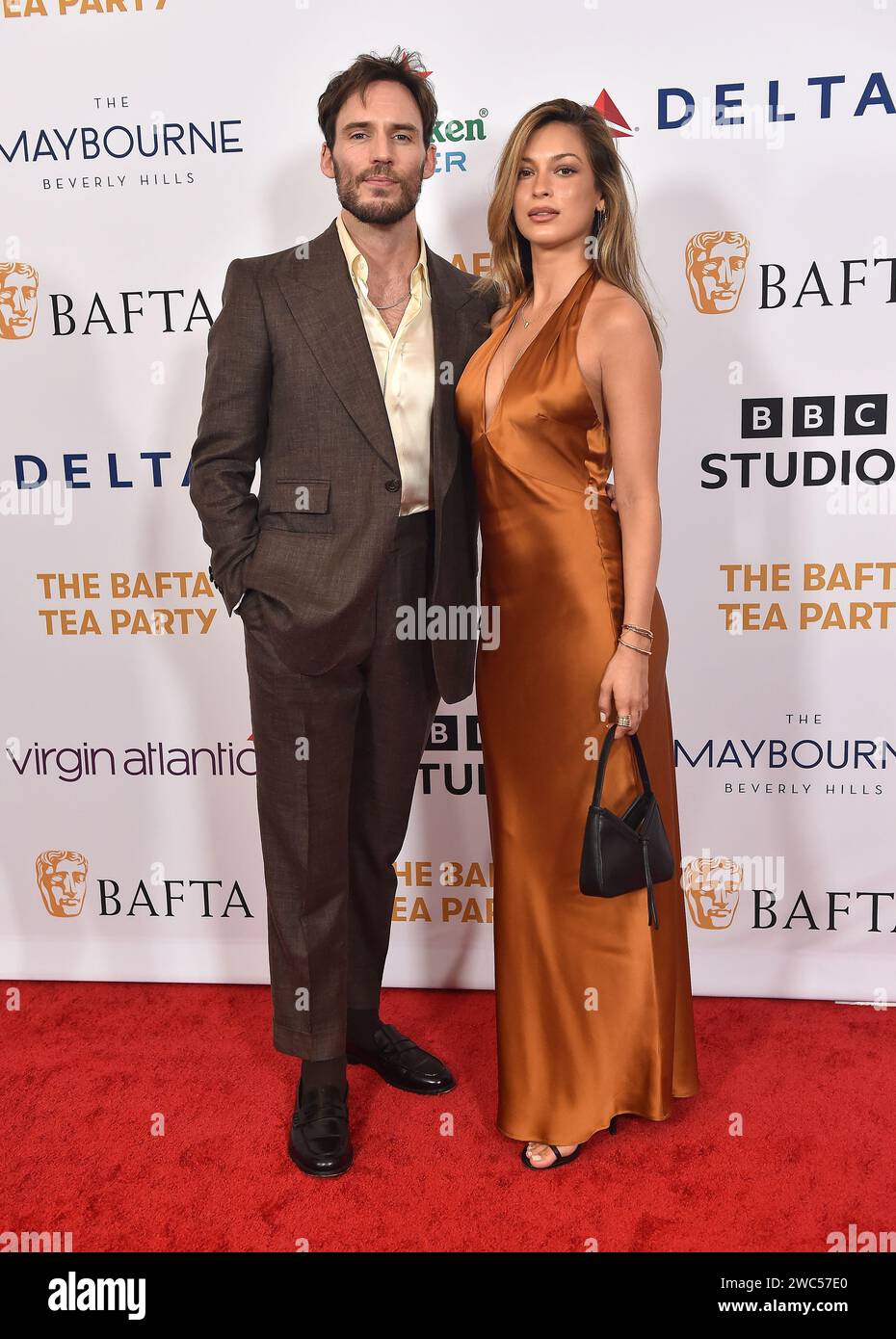 Beverly Hills, USA. 13th Jan, 2024. Sam Claflin and Cassie Amato ...