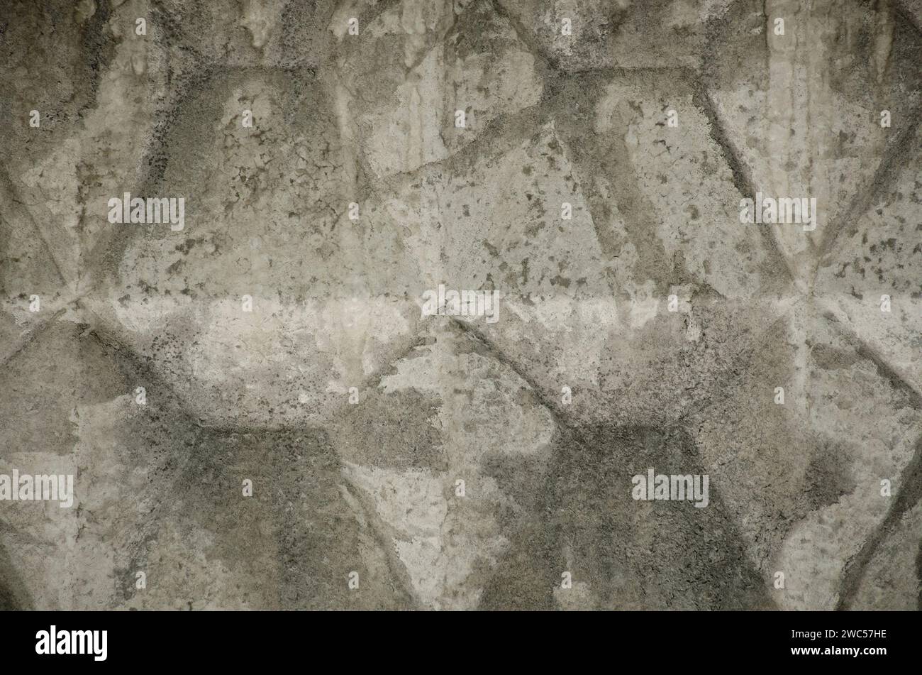 Abstract pattern, gray concrete fence. Concrete trapezoid paver blocks ...
