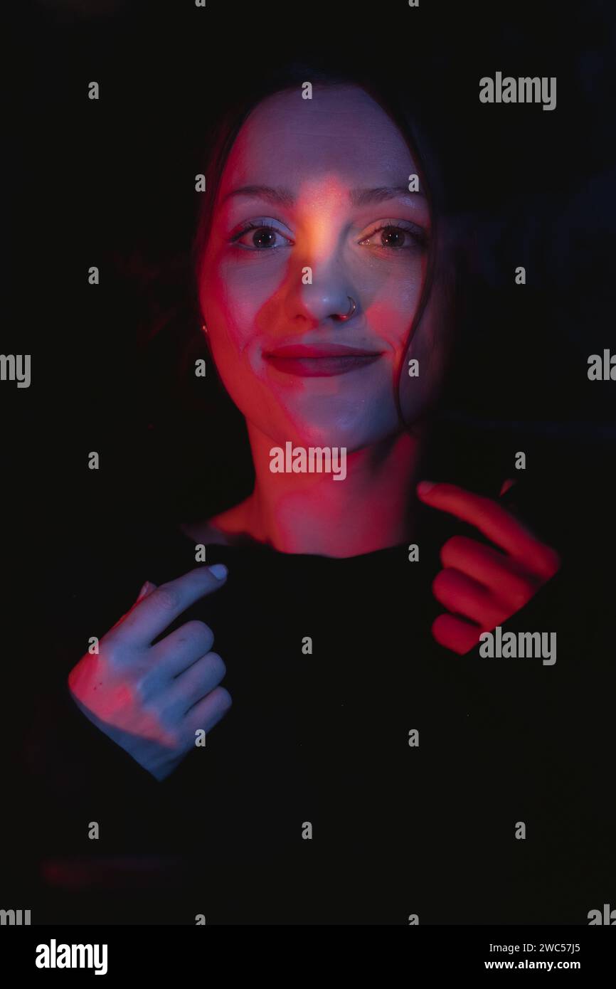 A captivating image featuring a stylish woman adorned in a sleek black ...