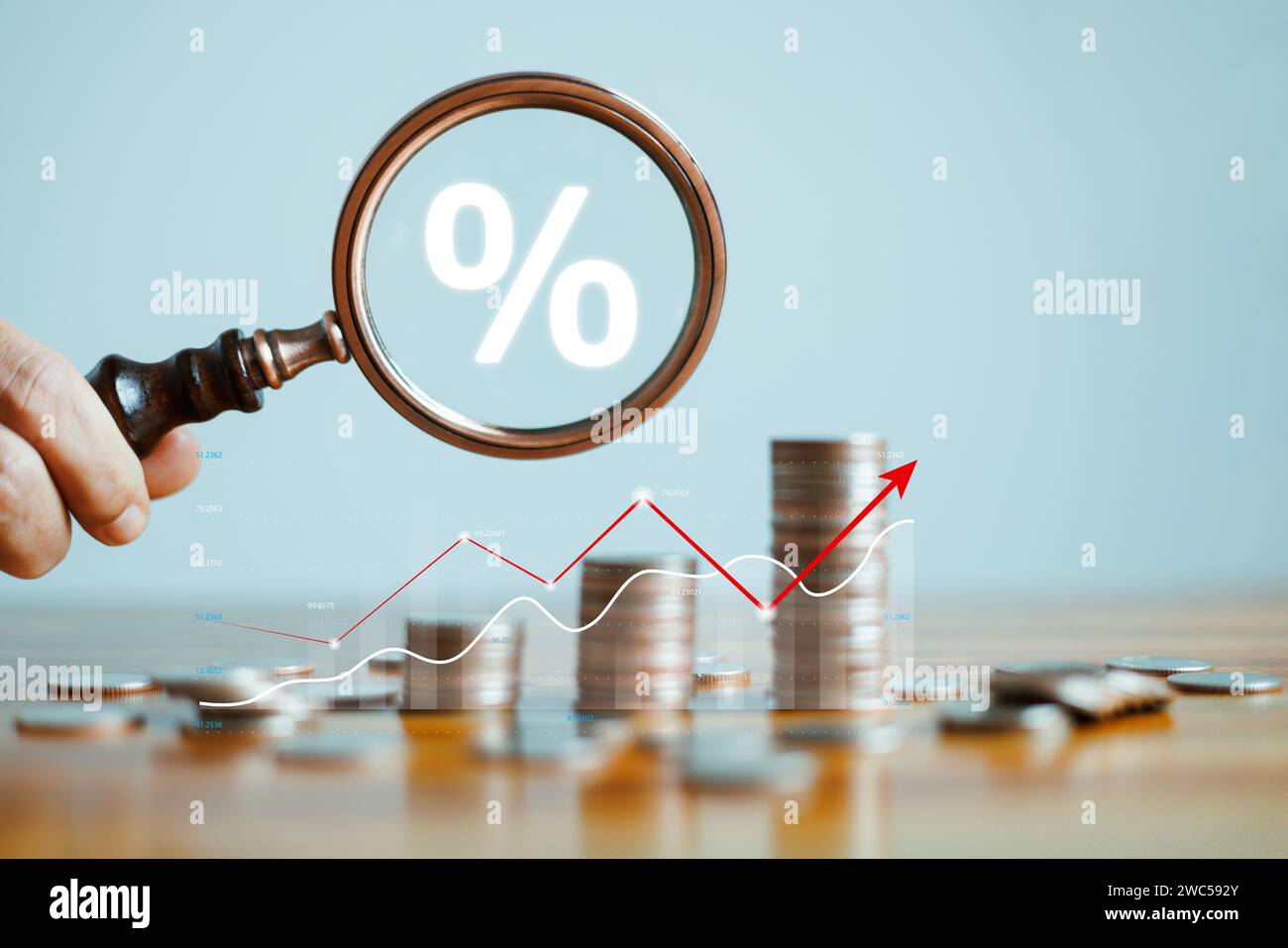 Customer hand using magnifying glass finding to percentage interest ...