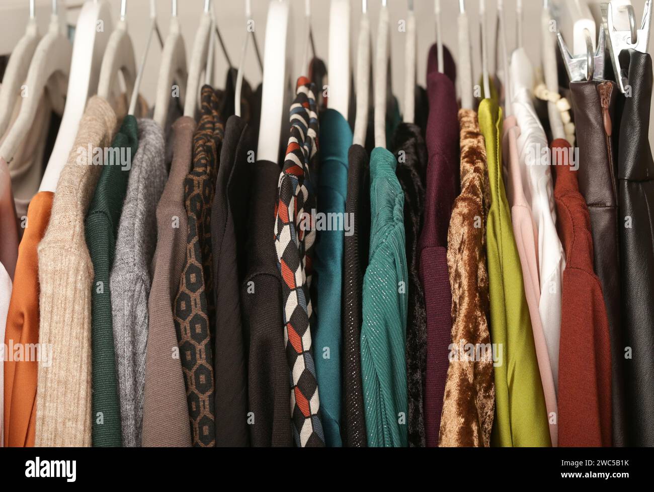 Women's fashion. Different clothes on hangers, close up. Huge selection ...