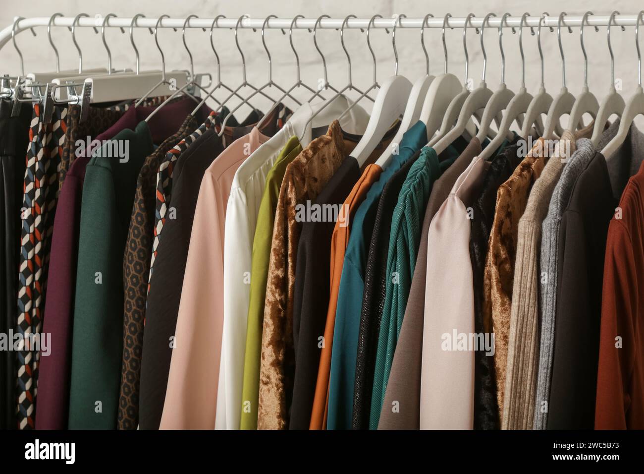 Women's fashion. Different clothes on hangers, close up. Huge selection ...