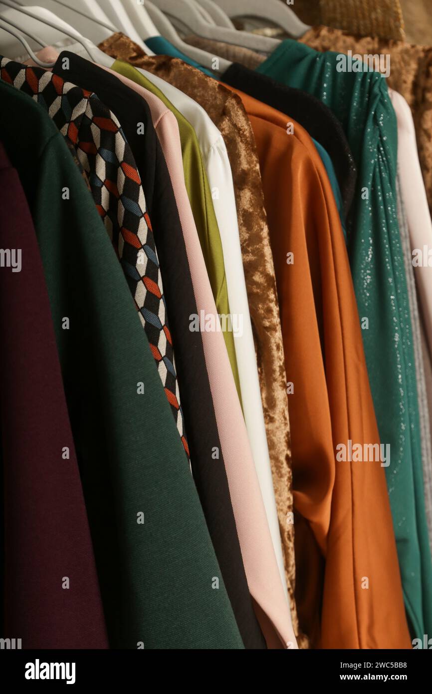 Women's fashion. Different clothes on hangers, close up. Huge selection ...