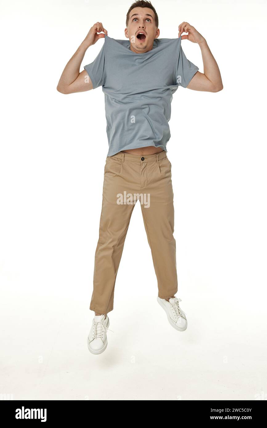 man holding himself by the shoulders isolated on white background Stock ...