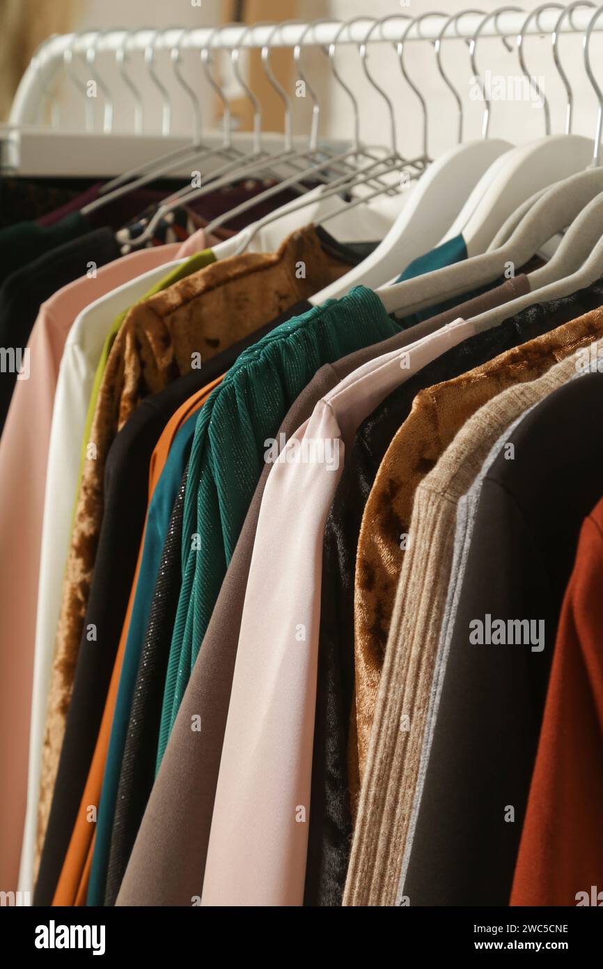 Women's fashion. Different clothes on hangers, close up. Huge selection ...