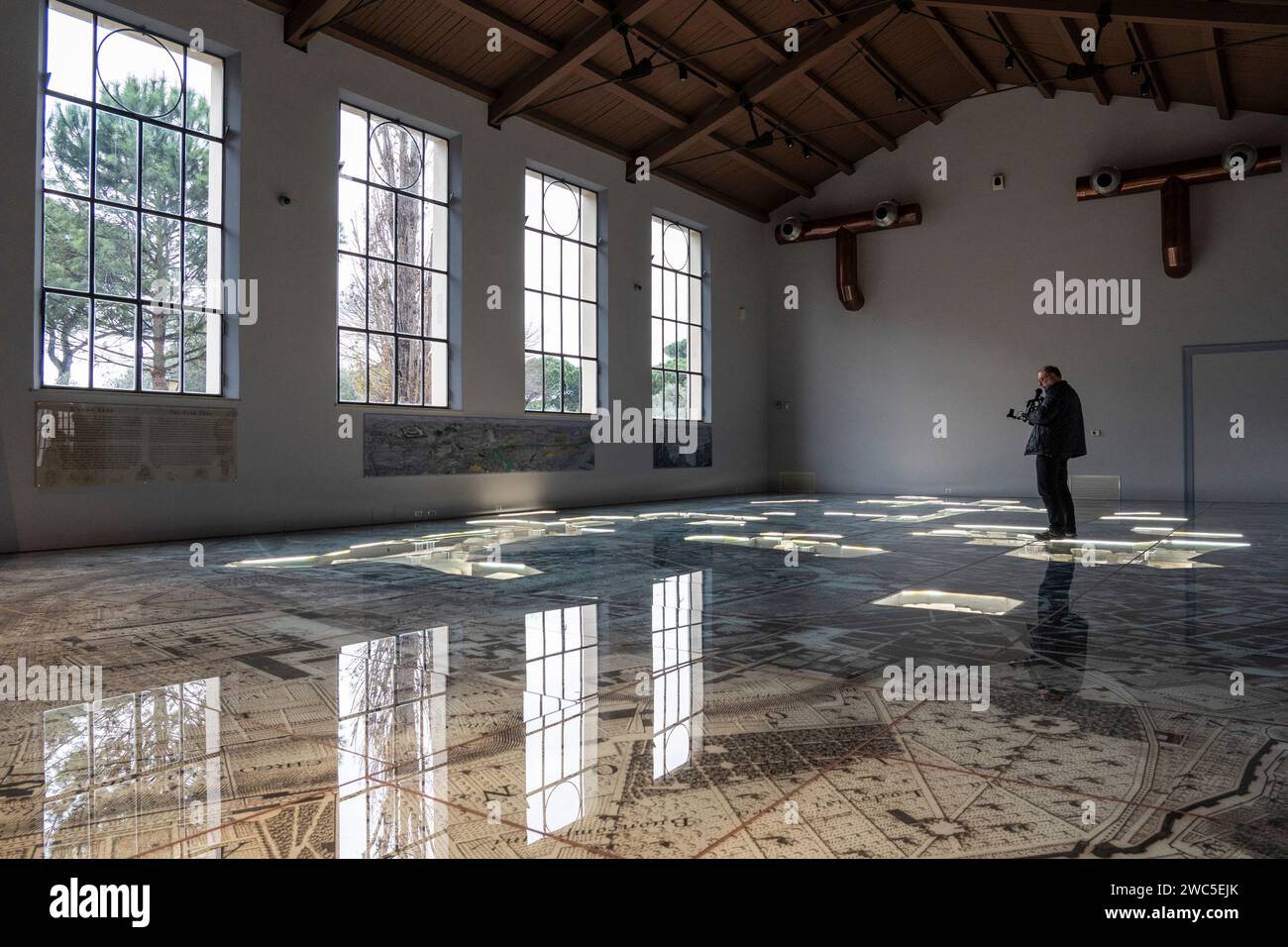 A videographer shoots images of the original marble map of the Ancient ...