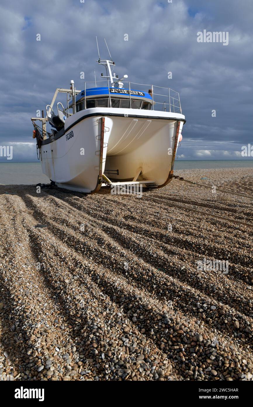 twin hull inshore fishing boat pulled up on shingle beach dungeness ...
