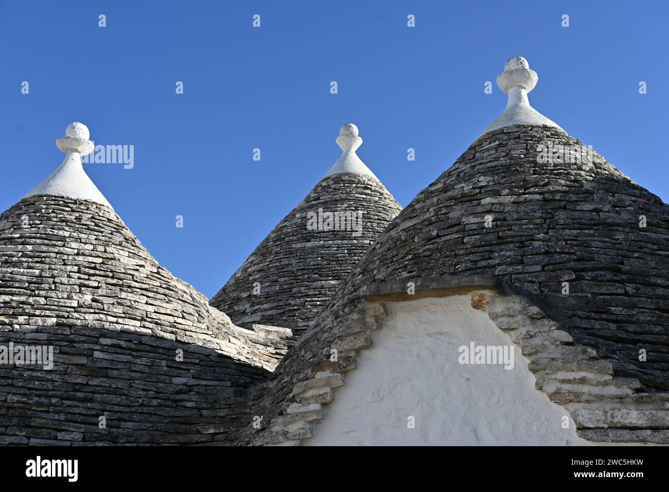 View of the conical roof of the trulli houses in Alberobello, Apulia ...