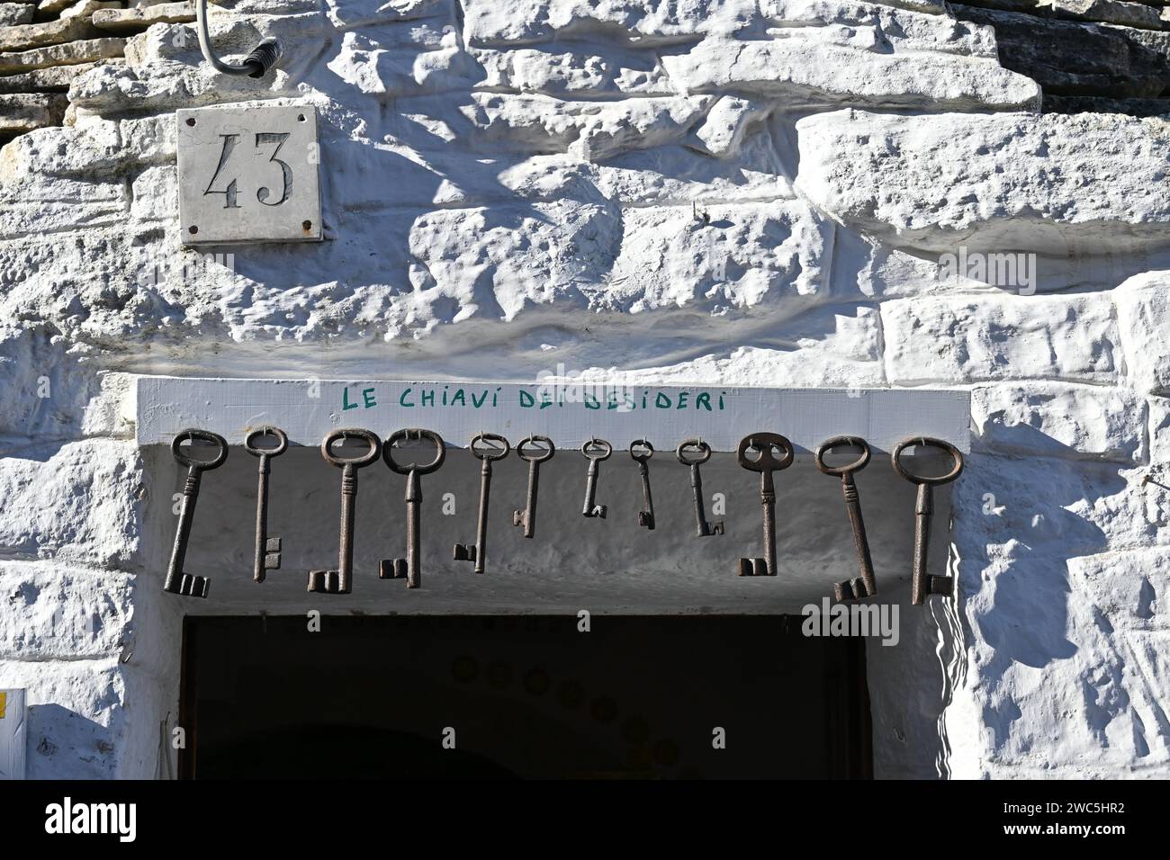 Old keys handing at the entrance of a trullo house in Alberobello ...