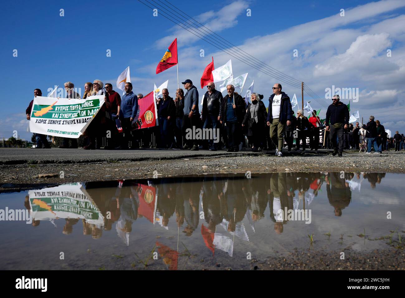 Demonstrators shout slogans, as they hold placards condemning Israel's ...