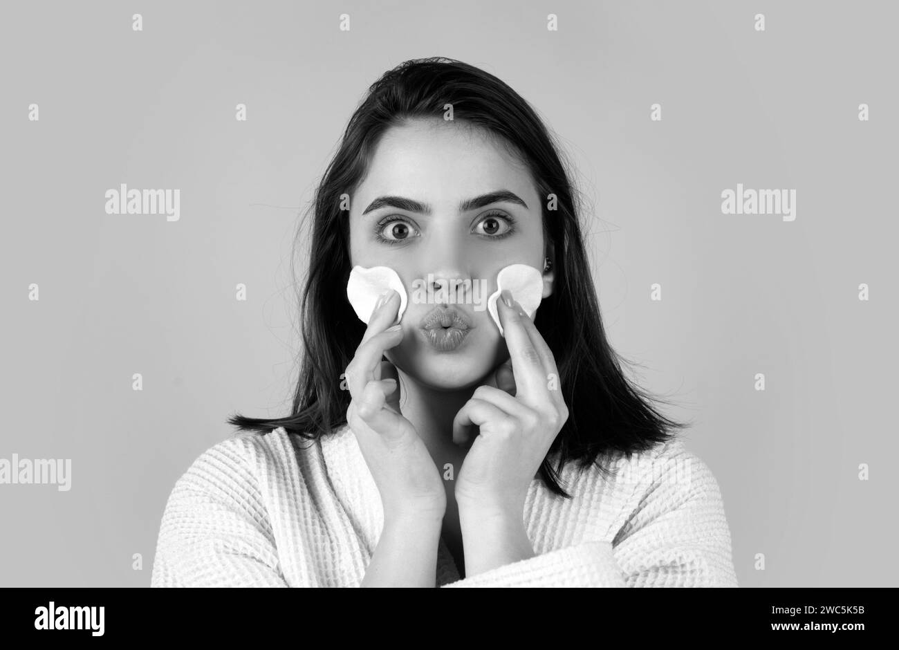 Pretty young girl with daily morning skincare procedures, cleansing ...