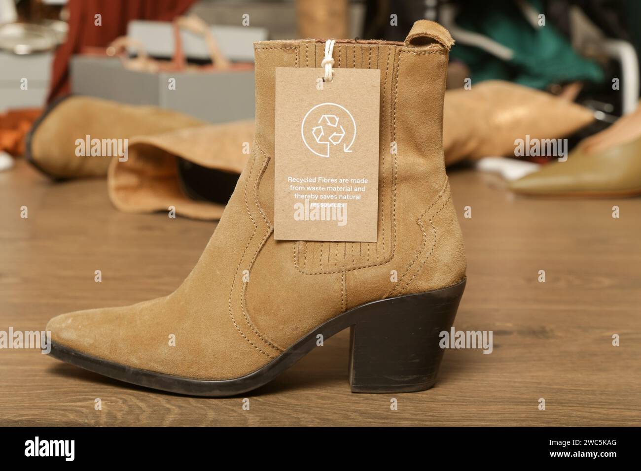 Clothing tag with recycle icon on the shoe. Recycling products concept ...