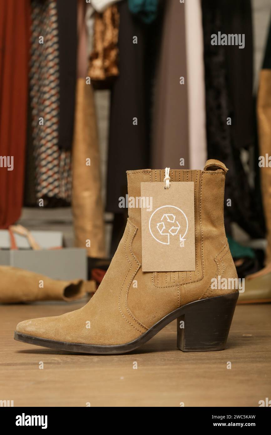 Clothing tag with recycle icon on the shoe. Recycling products concept ...