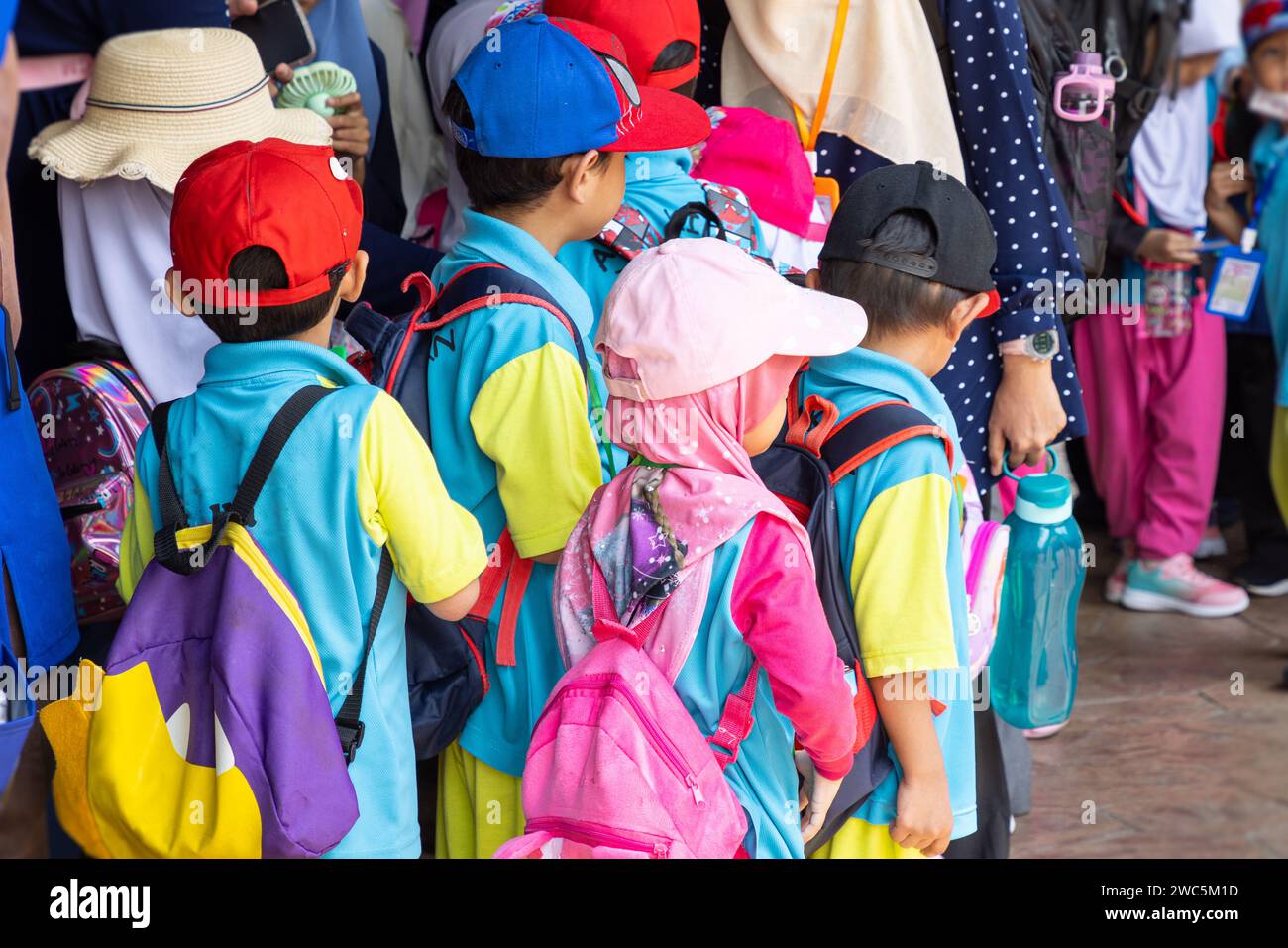 Primary or kindergartner School children boy or girl visit a park with ...
