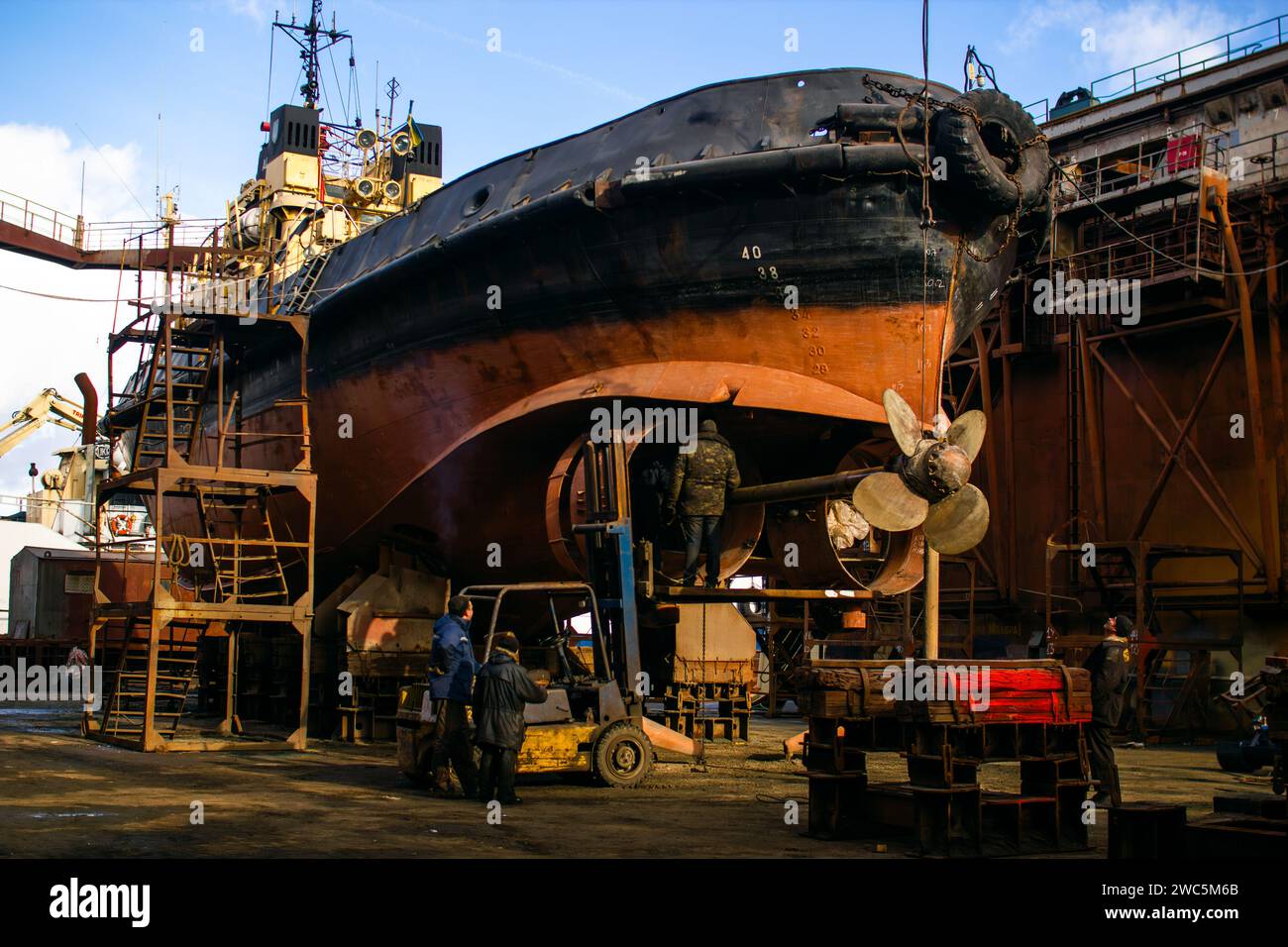 Industrial ship repair and maintenance executed by skilled workers at ...