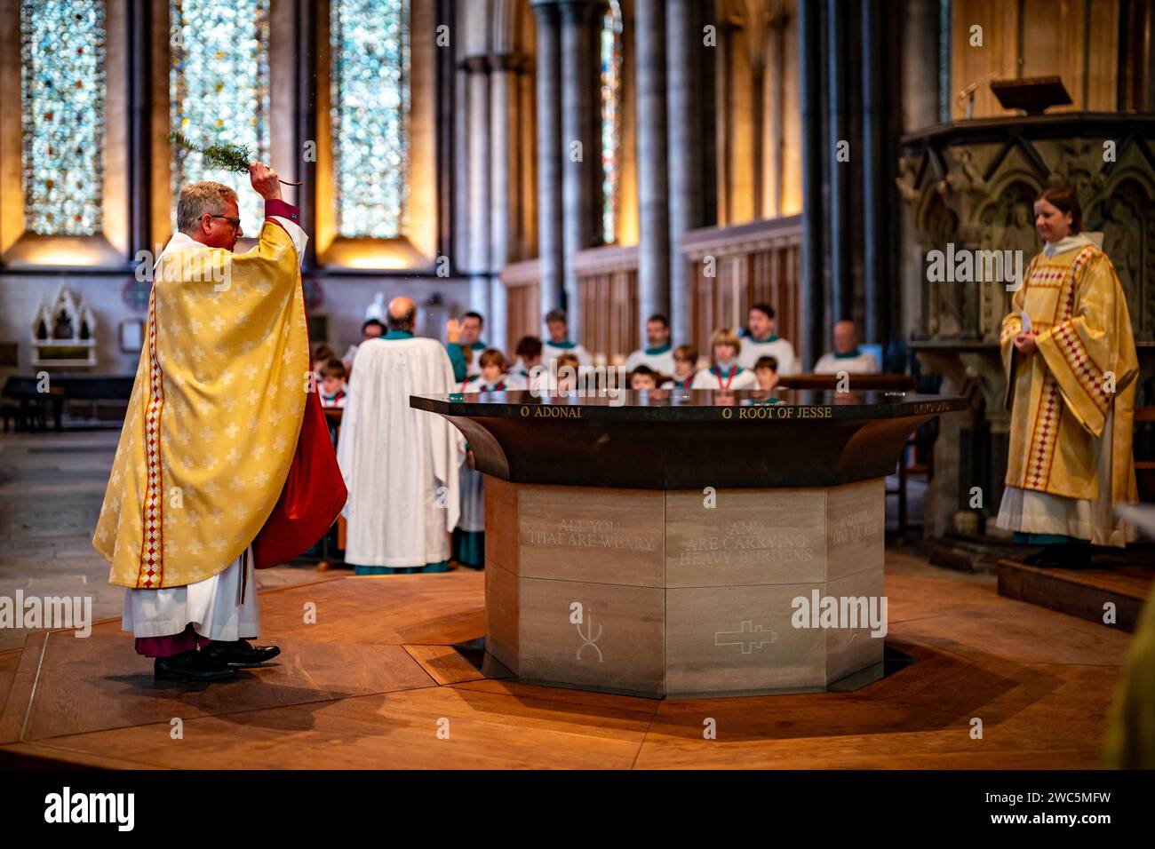 The Right Revd Stephen Lake, Bishop of Salisbury, sprinkles holy water ...