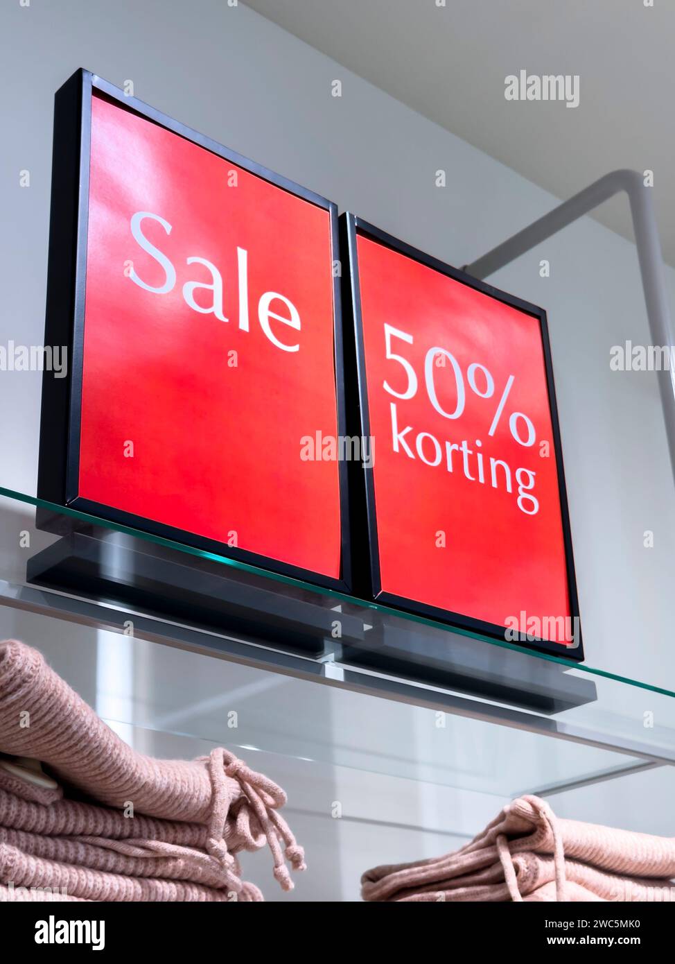 Dutch January sale in shops with 50% off - vibrant red signs showcase ...