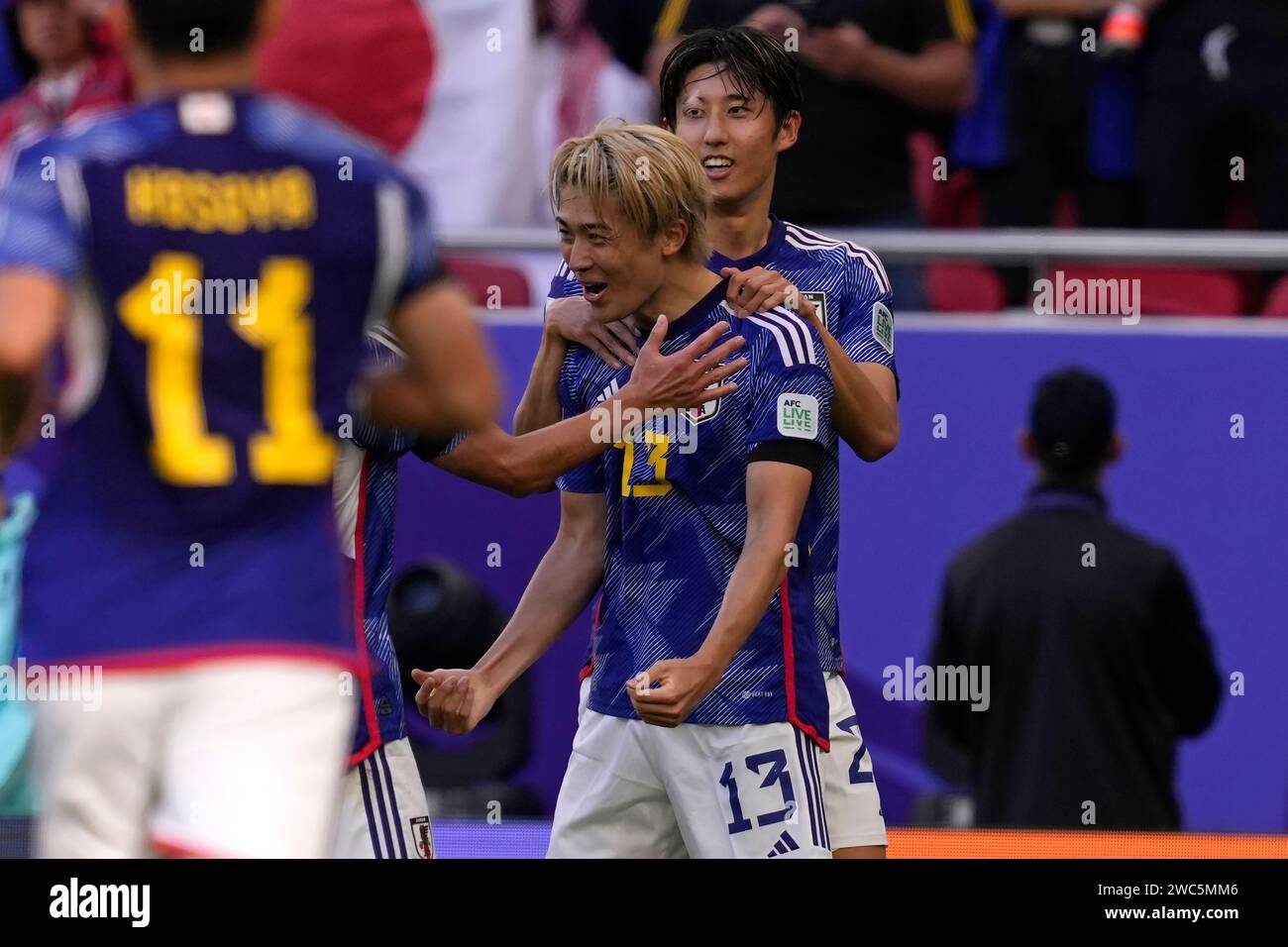 Japan's Keito Nakamura, second right, celebrates after scoring his side ...