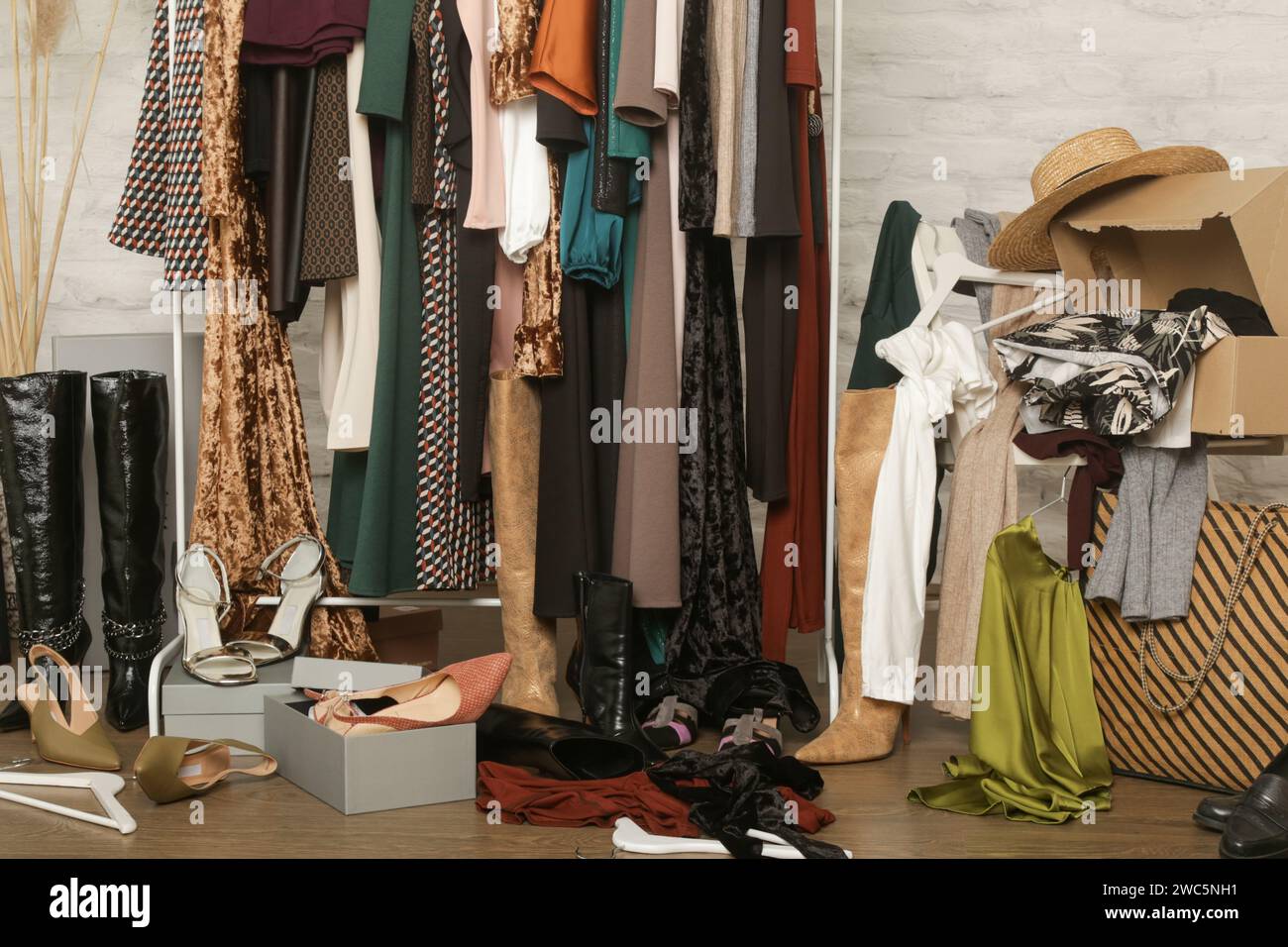 Untidy cluttered woman wardrobe with stylish clothes and accessories ...