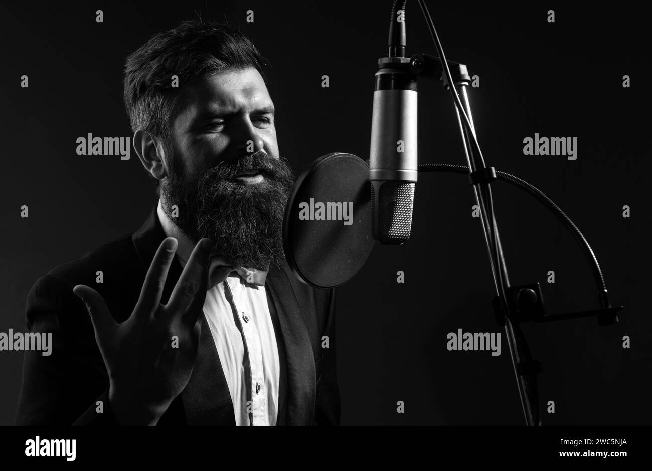 Singer singing classical music. Sound producer recording song in a ...