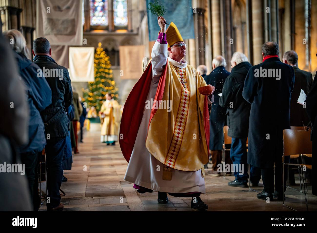 The Right Revd Stephen Lake, Bishop of Salisbury, sprinkles holy water ...