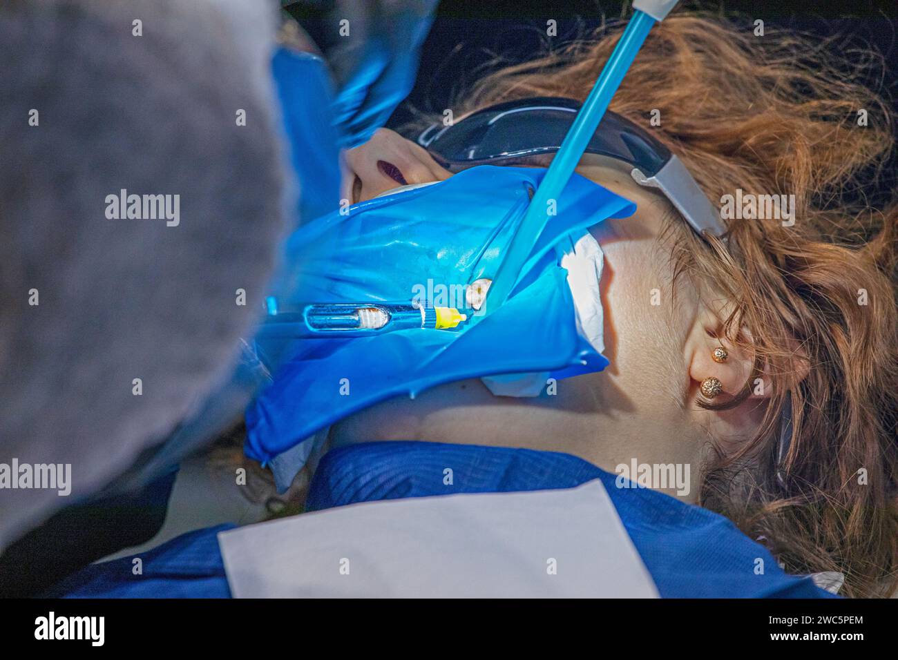 give an injection of anesthesia to a sick woman before his treatment ...