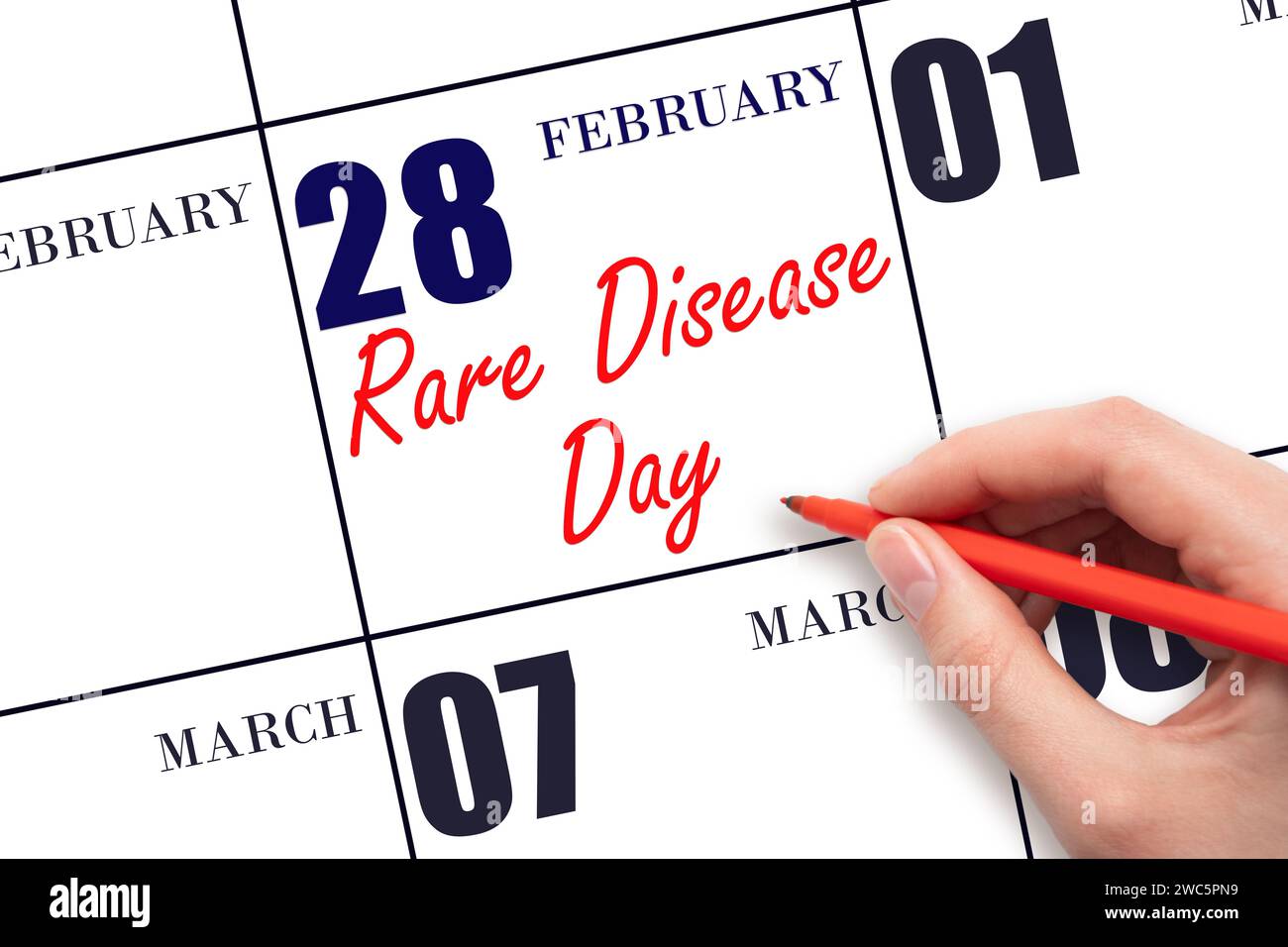 February 28. Hand writing text Rare Disease Day on calendar date. Save ...
