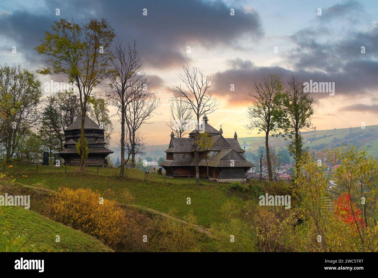 Traditional wooden church in the mountain valley. Picturesque landscape ...
