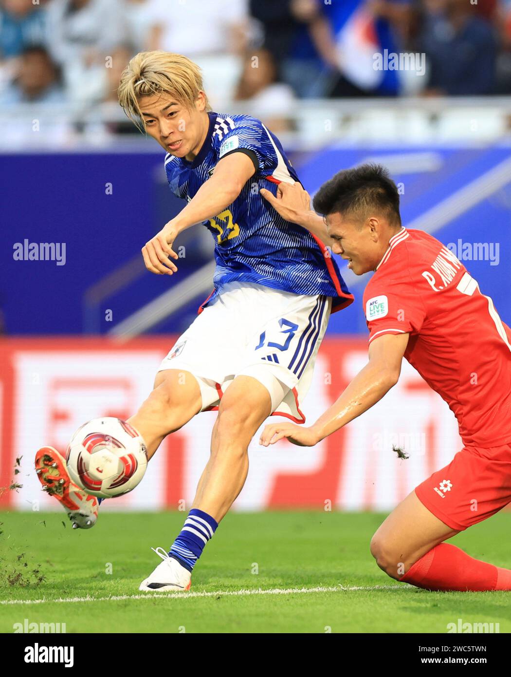 Japan's Keito Nakamura (L) scores a goal during the AFC Asian Cup ...