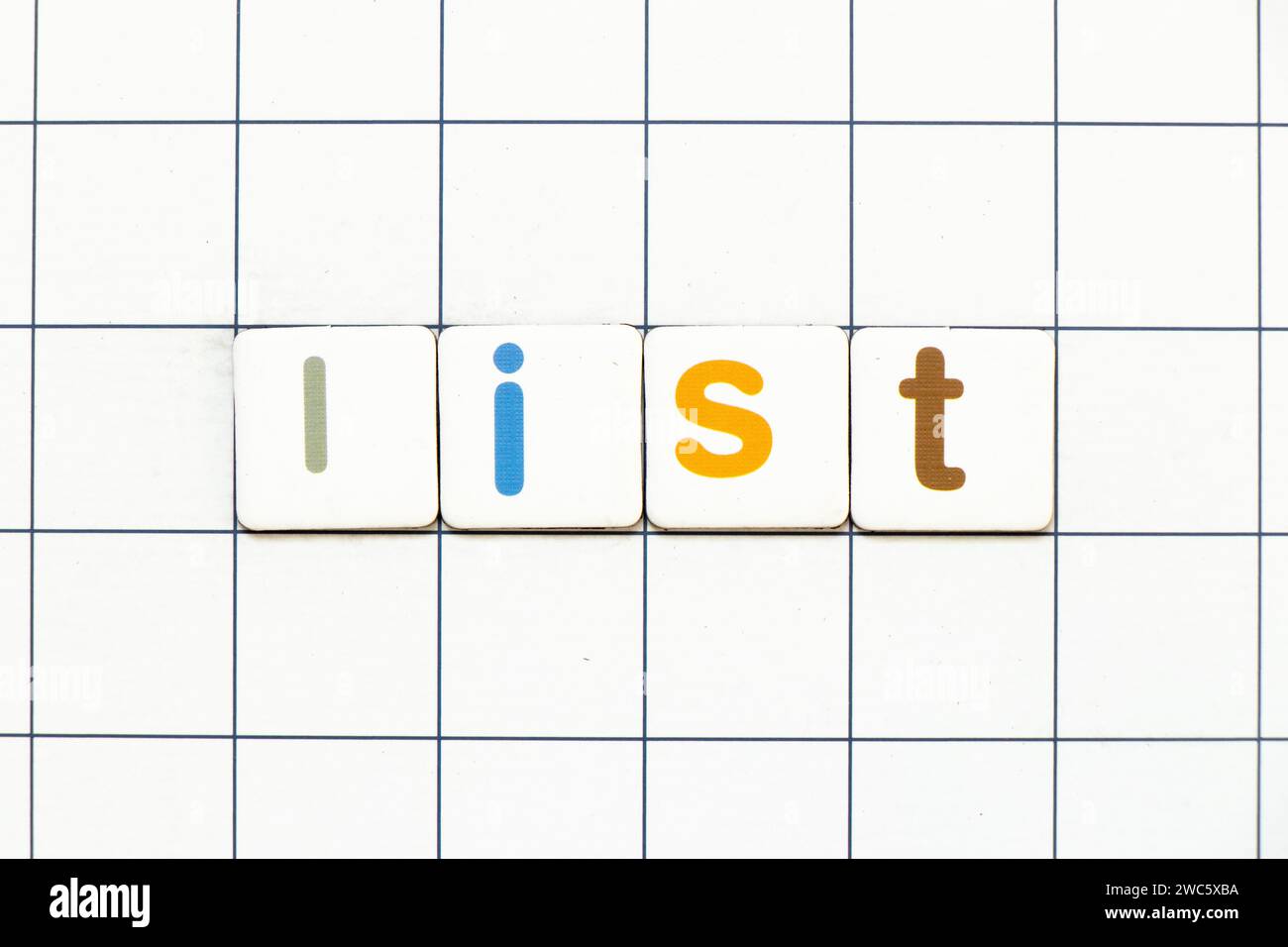 Colorful tile letter in word list on white grid background Stock Photo ...
